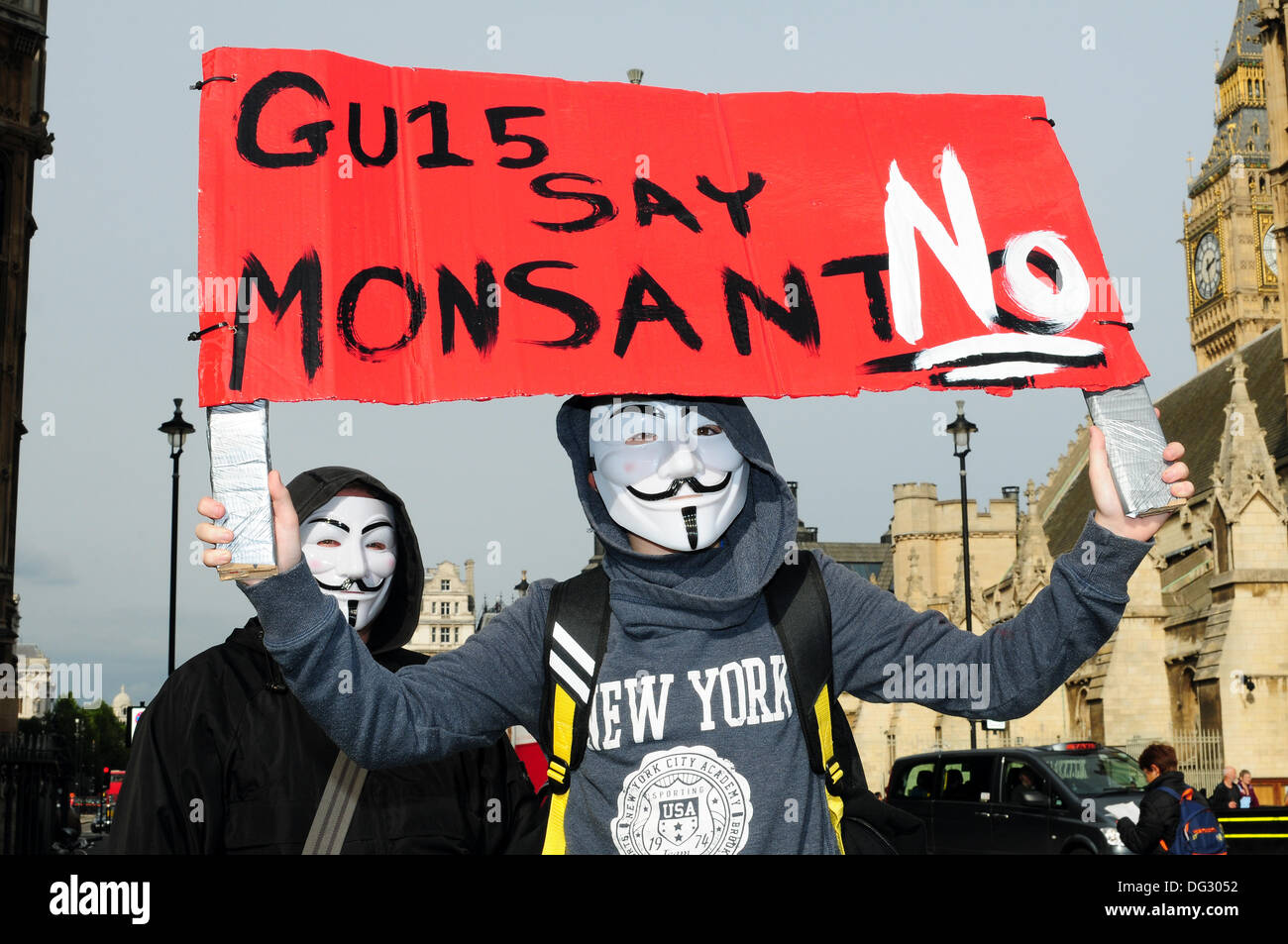 London UK, 12th Oct 2013 : Two protesters wearing a anonymous mask ...