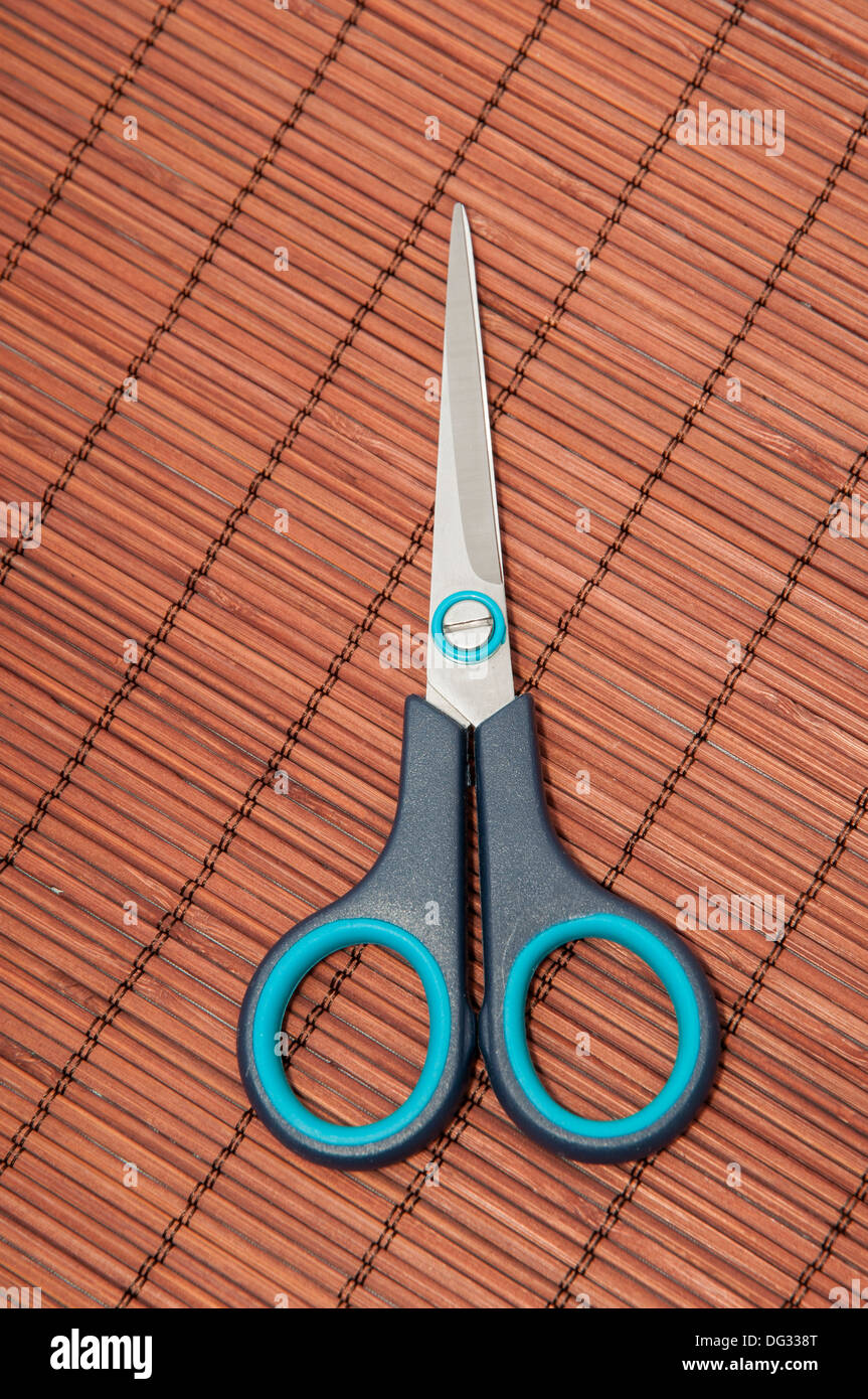 scissors to cut on a wooden background Stock Photo - Alamy