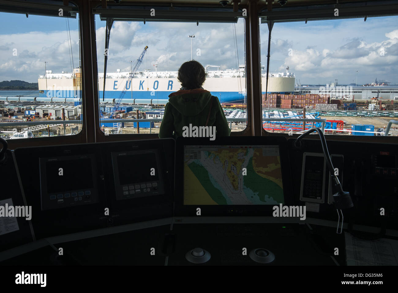 Person on the bridge of the RRS Discovery ship research vessel docked ...