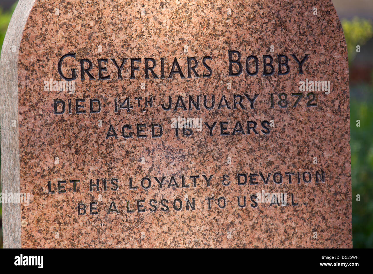 City of Edinburgh, Scotland. Close up view of the inscription on a red ...
