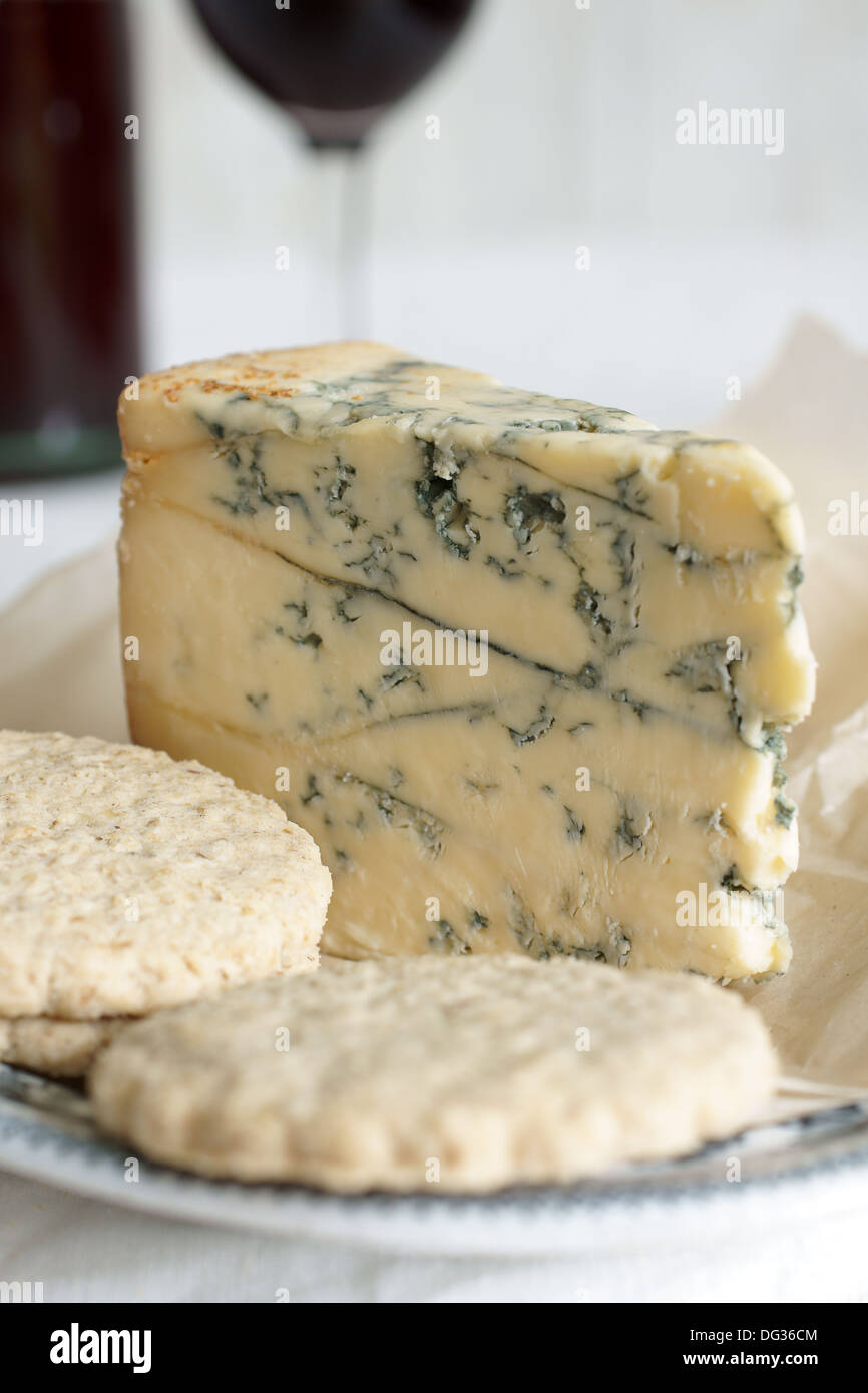Stilton cheese on aged parchment paper with oat biscuits. Selective ...