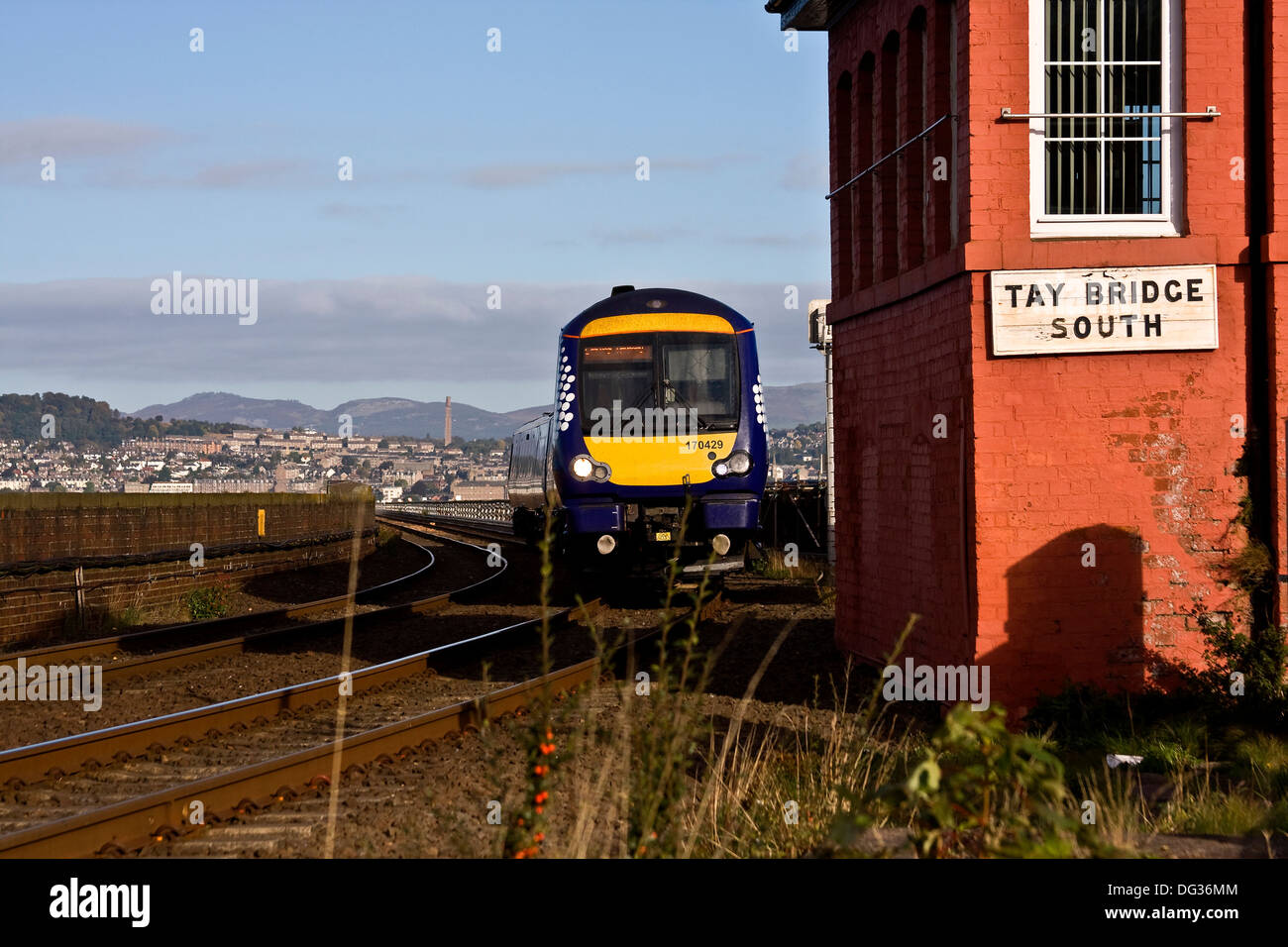 Scotrail commuter train crossing the Tay railway bridge from Dundee ...