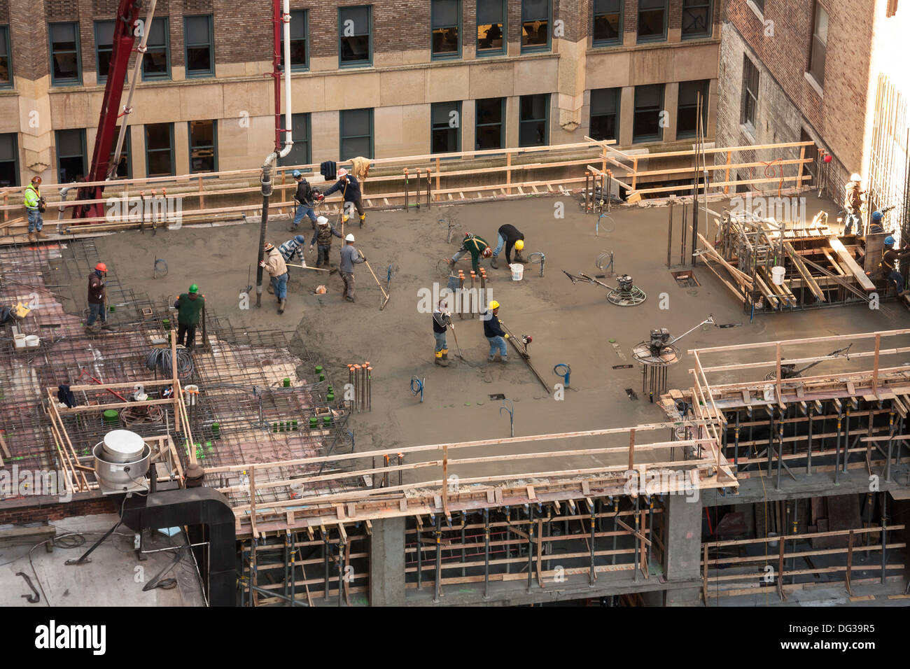 High-rise Building Construction Site with tradesmen Stock Photo - Alamy