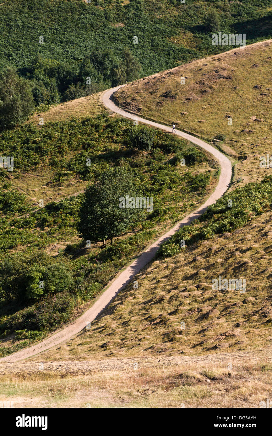 Small figure of runner on path in Malvern Hills, Herefordsire England ...