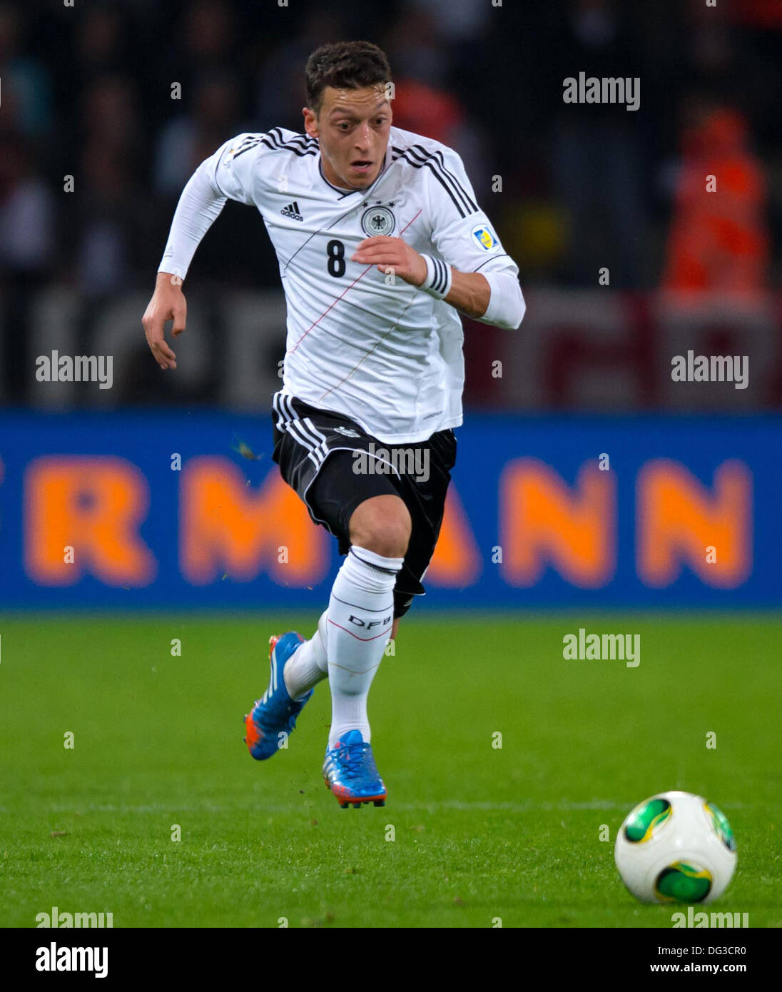 Cologne, Germany. 11th Oct, 2013. Germany's Mesut Ozil vies for the ...
