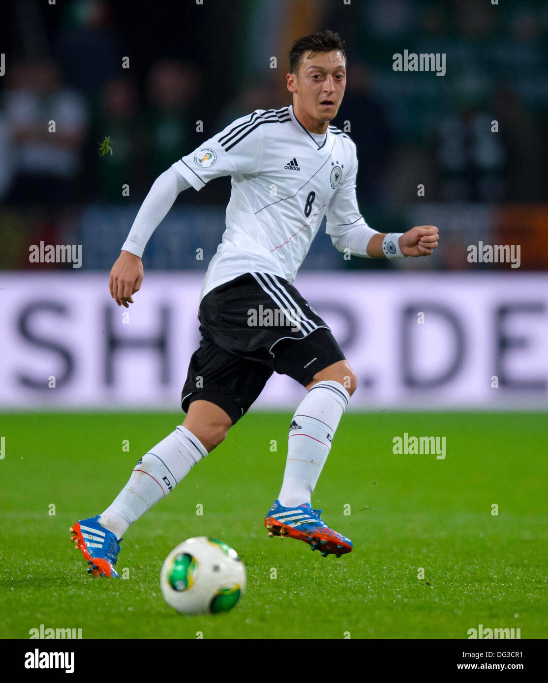 Cologne, Germany. 11th Oct, 2013. Germany's Mesut Ozil vies for the ...