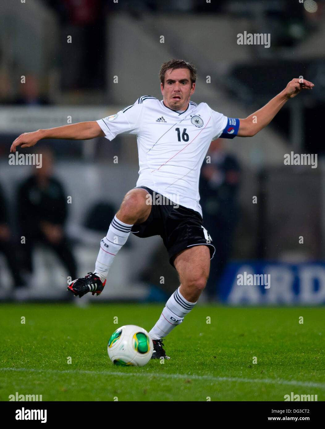 Cologne, Germany. 11th Oct, 2013. Germany's Philipp Lahm vies for the ...