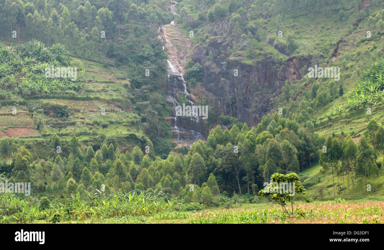 Waterfall with trees, woodland, cliffs & agriculture foreground Rural ...