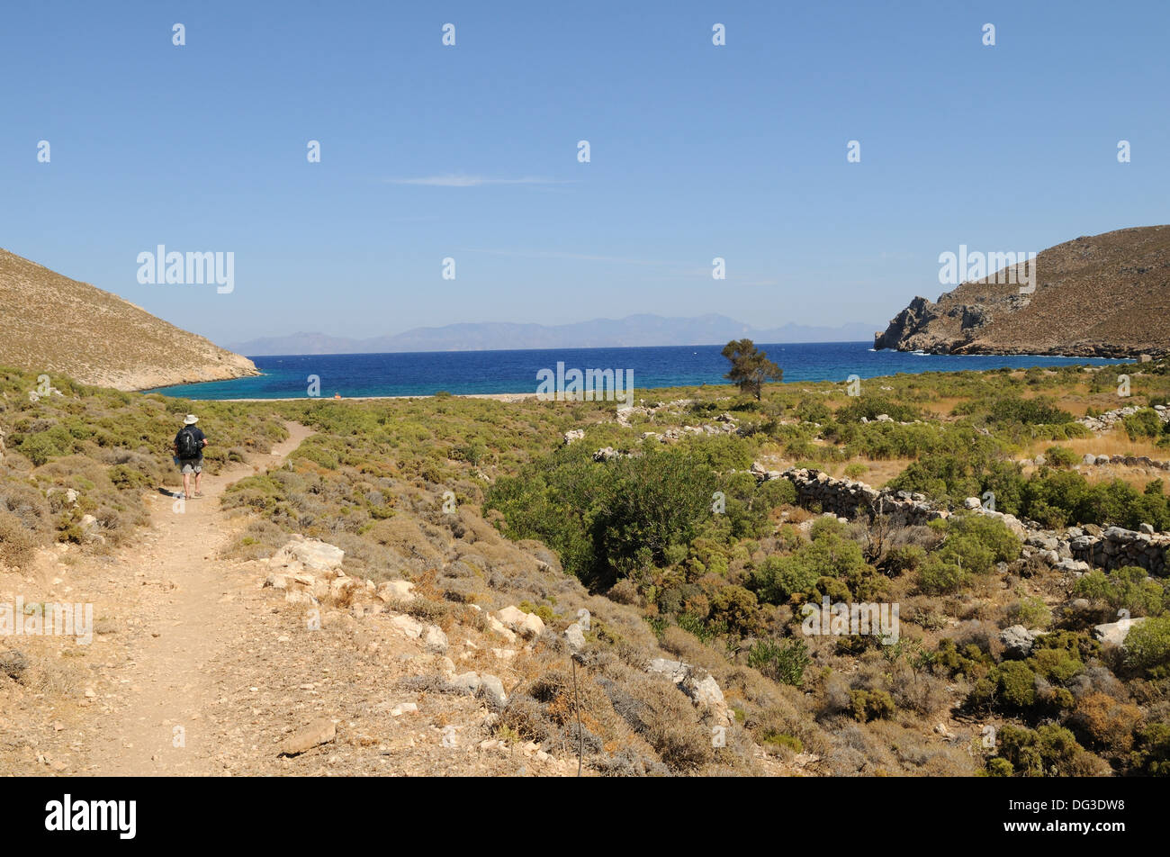 Walker on the footpath to Skafi Beach Tilos Greek Island The Dodecanese ...