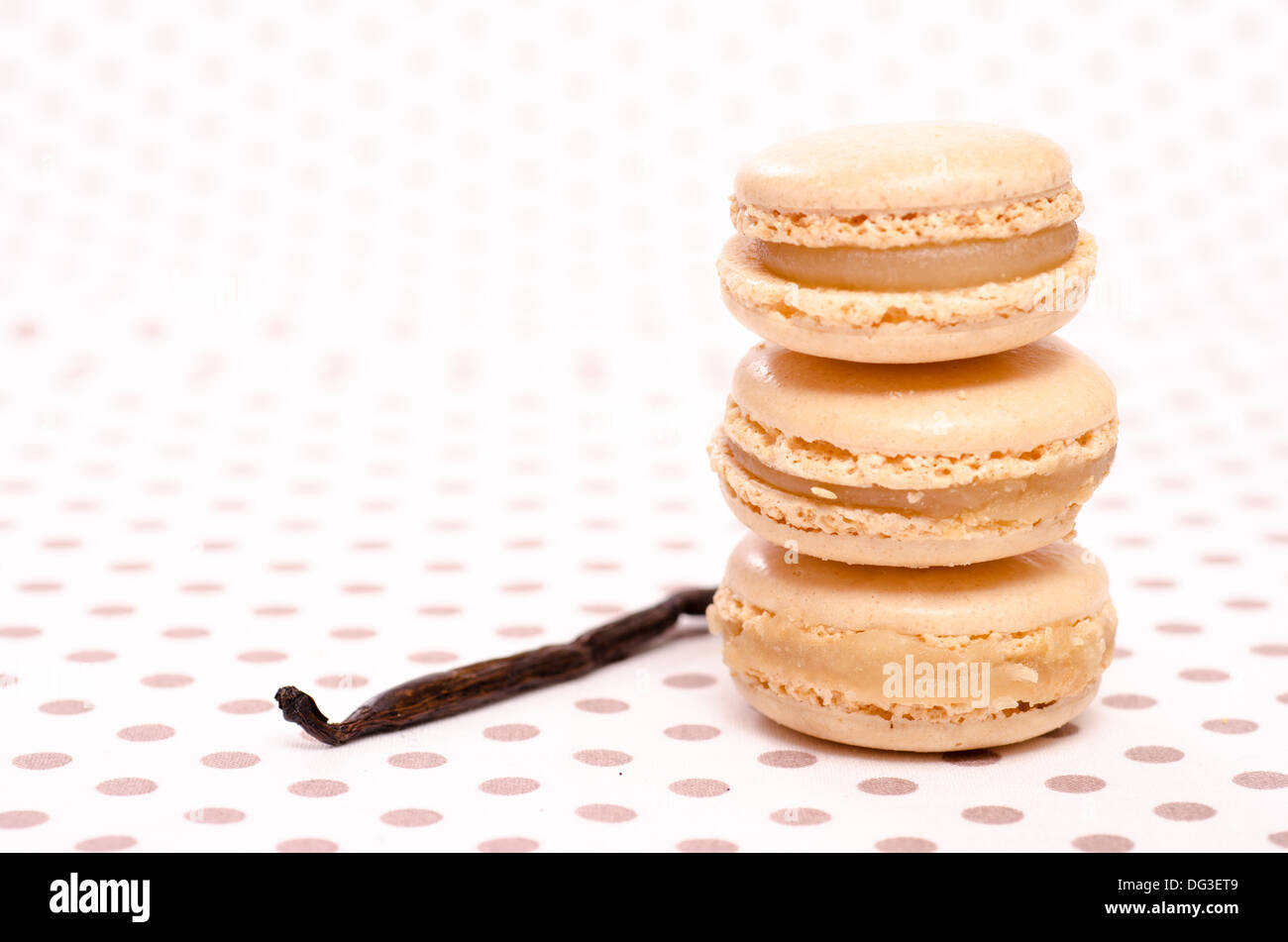 Stack of three macarons with flavour of vanilla Stock Photo - Alamy