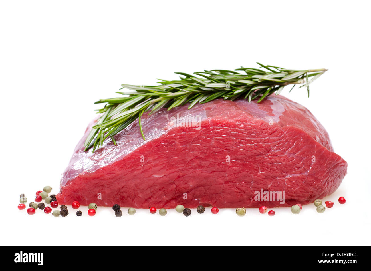 Raw beef with condiments on a white background Stock Photo - Alamy