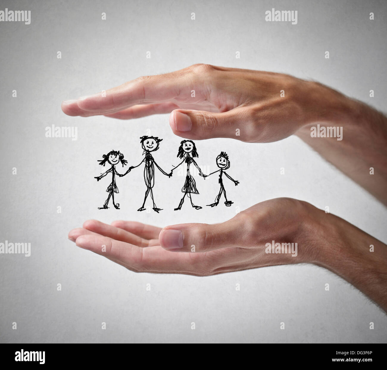 Two hands protecting the sketch of a family Stock Photo - Alamy