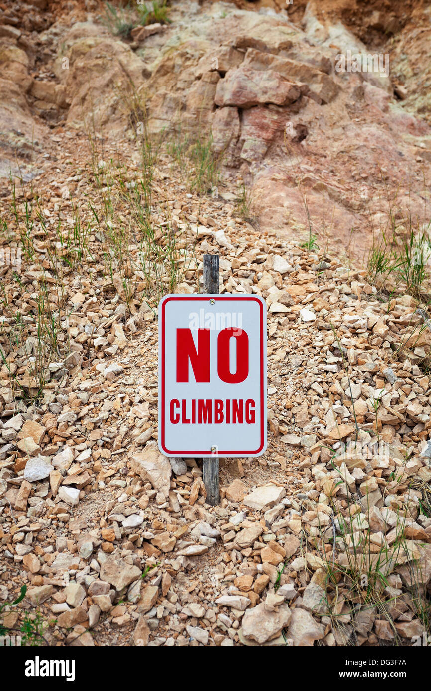 No Climbing sign against hillside buried in falling rock, Colorado ...