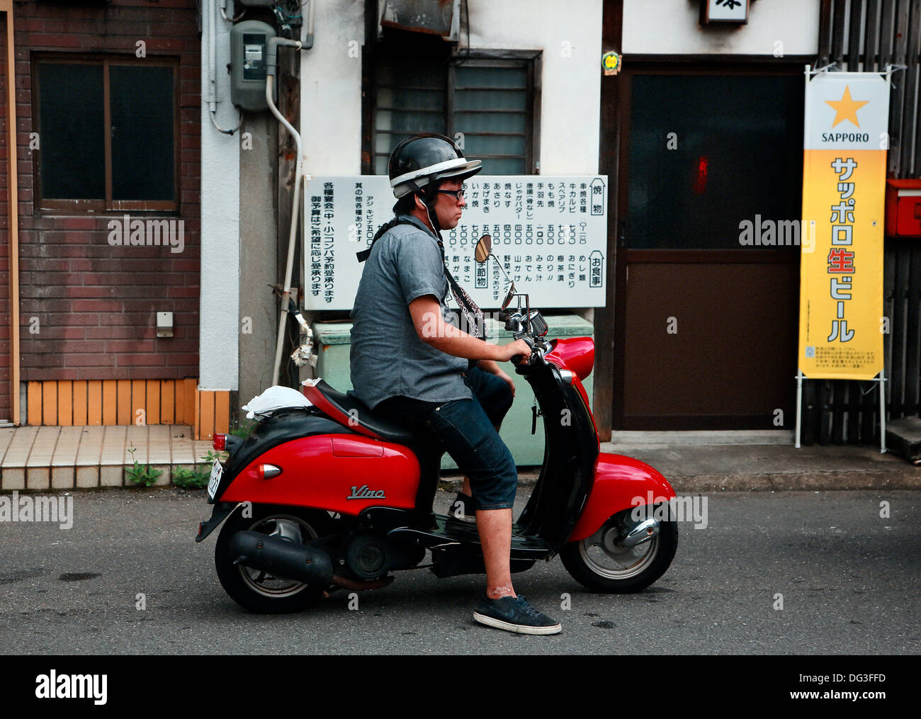 Man moped hi-res stock photography and images - Alamy