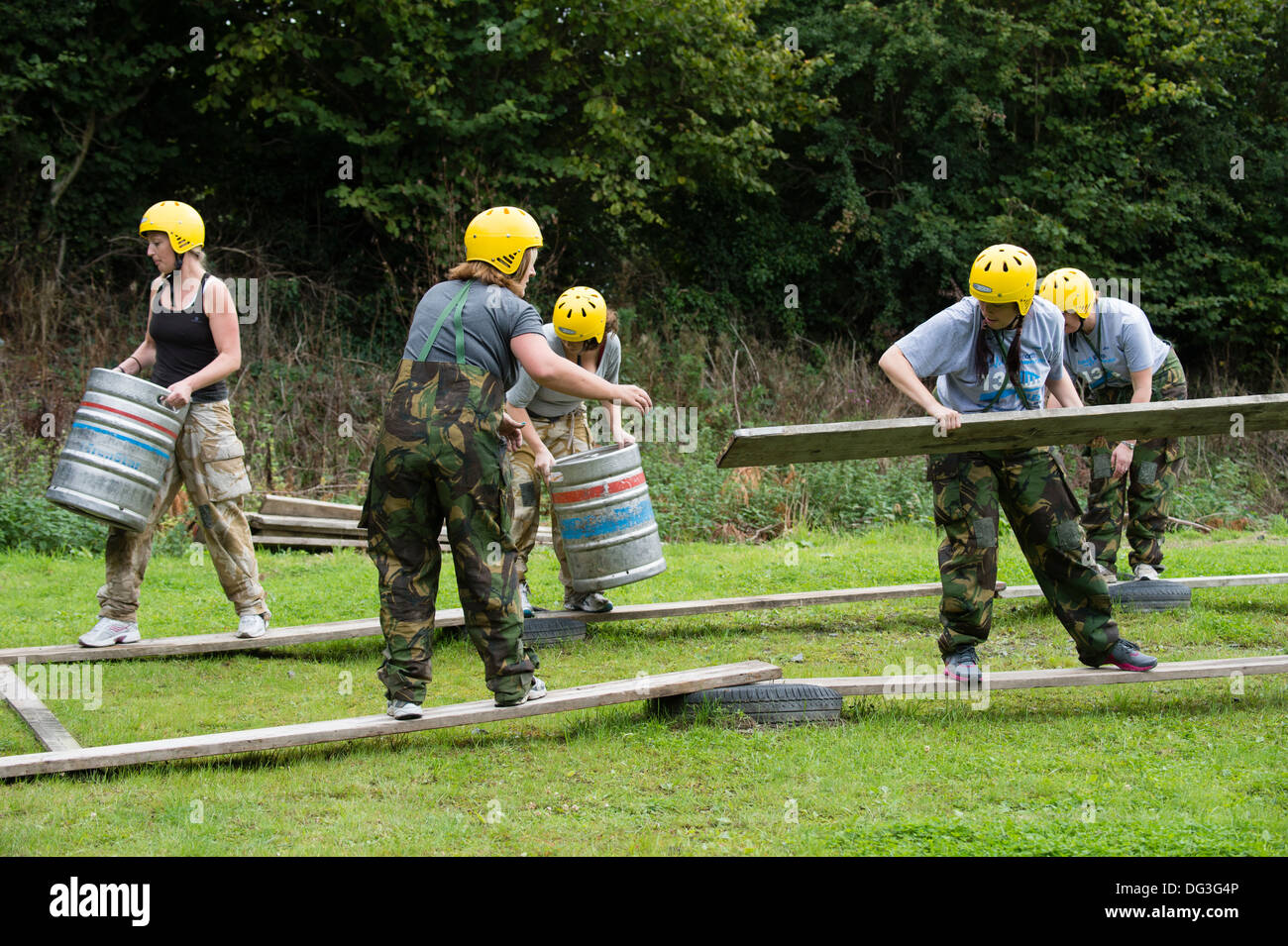 A group of adult women on a team building teambuilding exercise problem ...