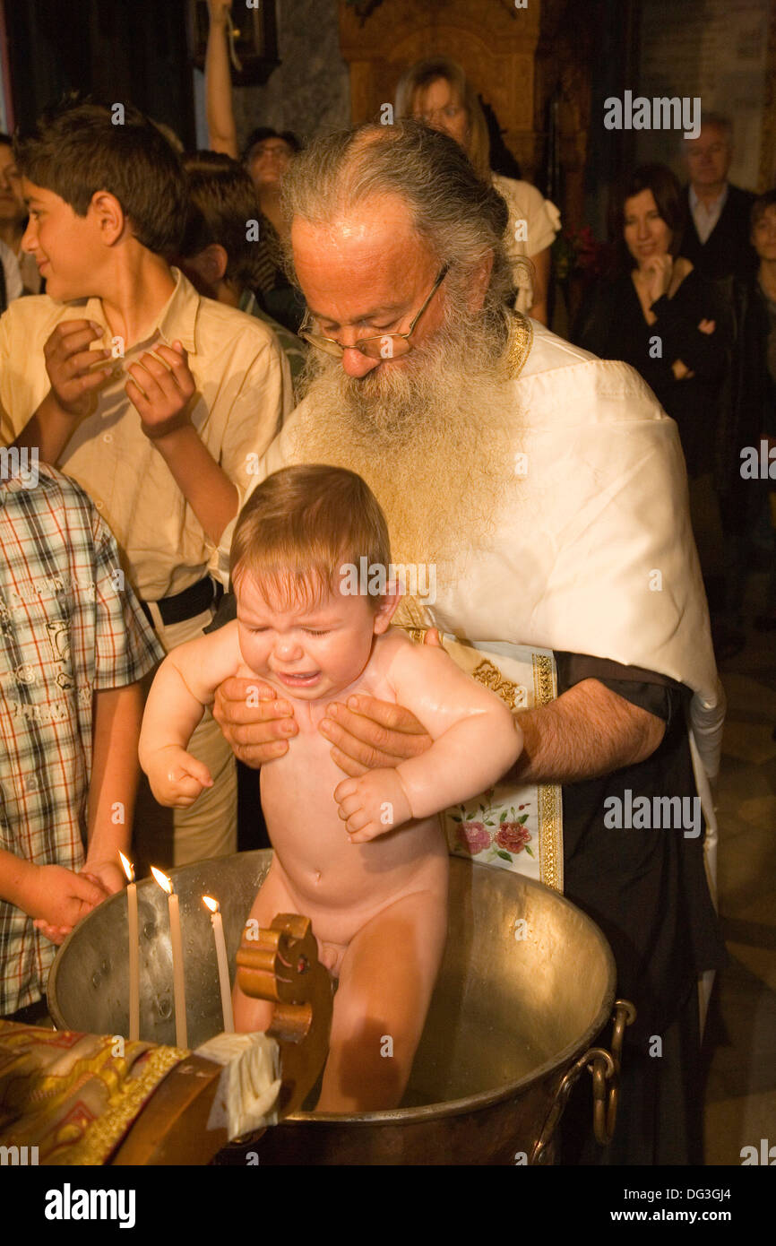 Infant baptism priest hi-res stock photography and images - Alamy