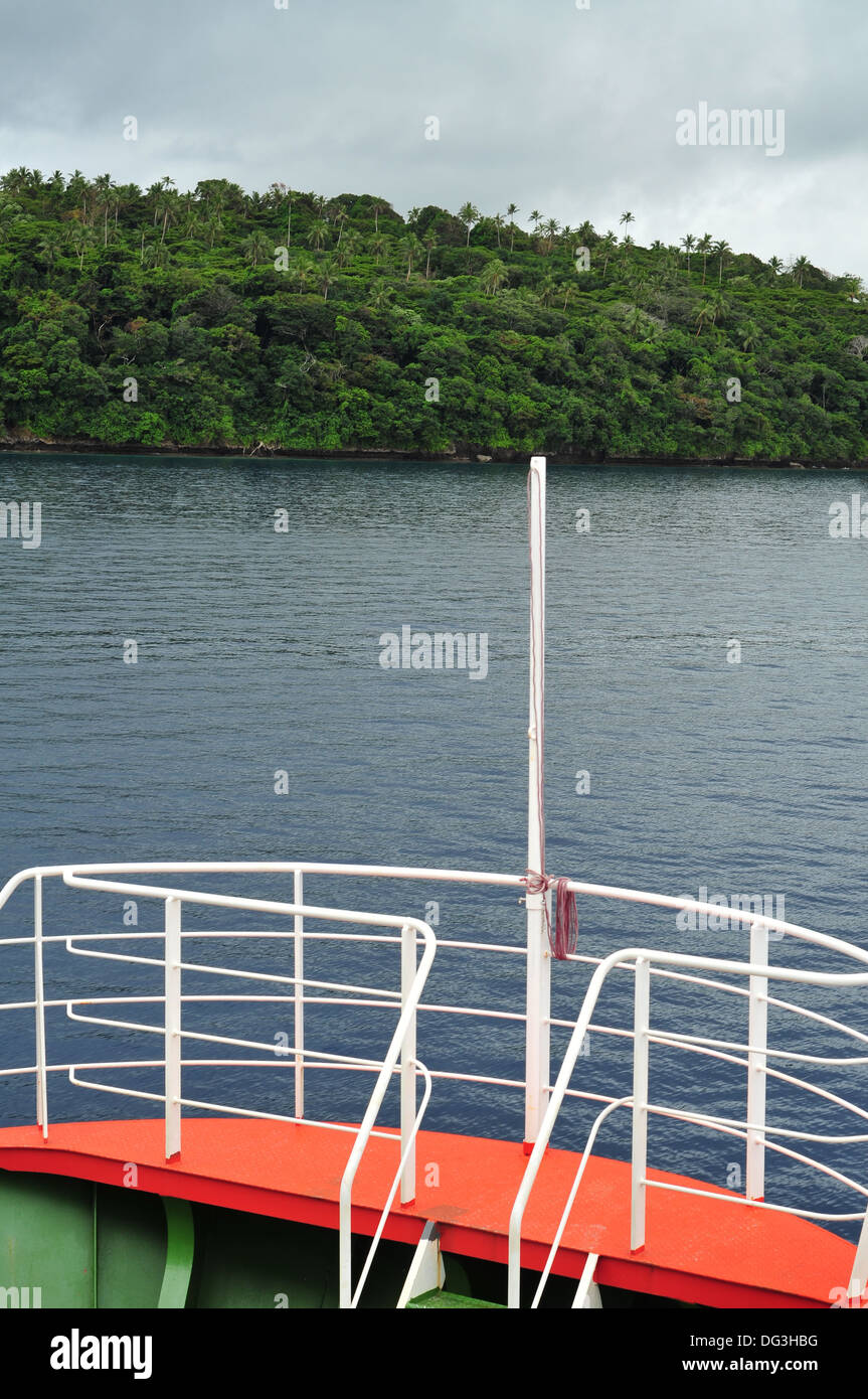 Tropical island forest in front of ship's bow Stock Photo - Alamy