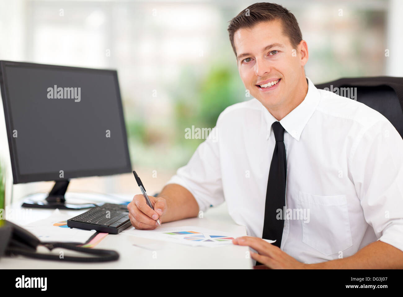 happy corporate worker working in office Stock Photo - Alamy