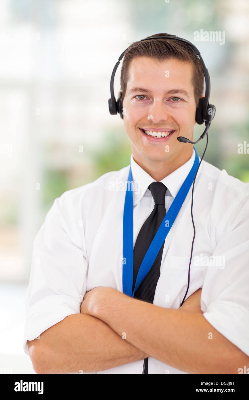 portrait of happy call center customer service worker with arms crossed ...