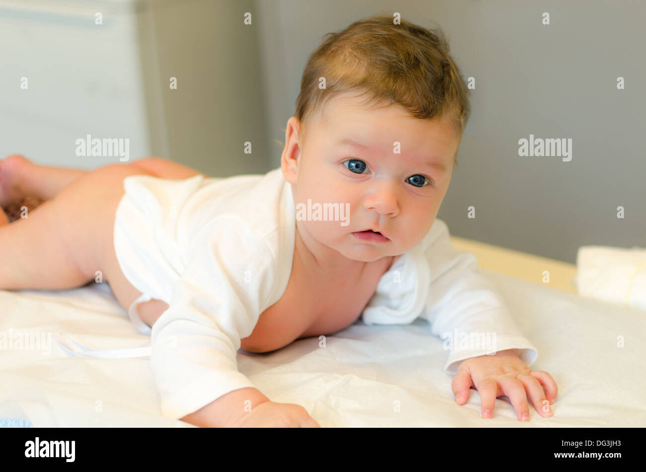 Baby looks down hi-res stock photography and images - Alamy