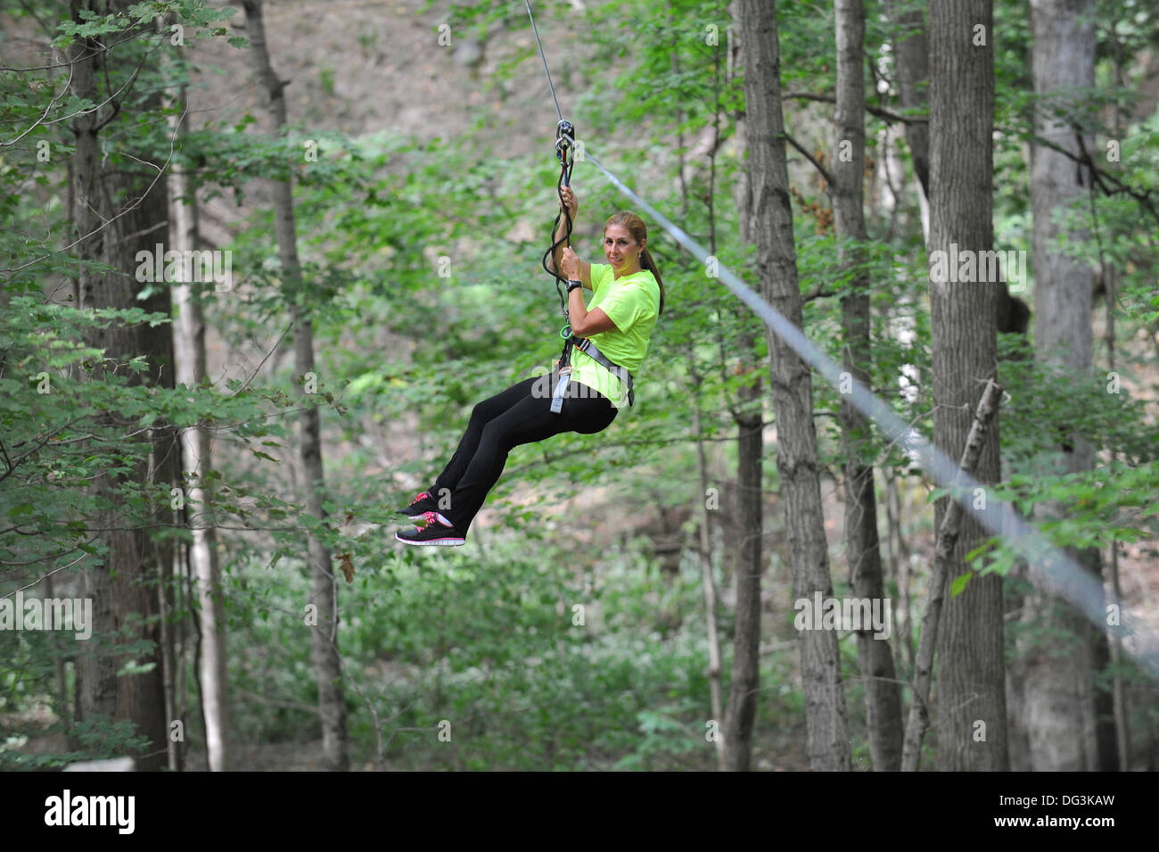 Female zip lining hi-res stock photography and images - Alamy