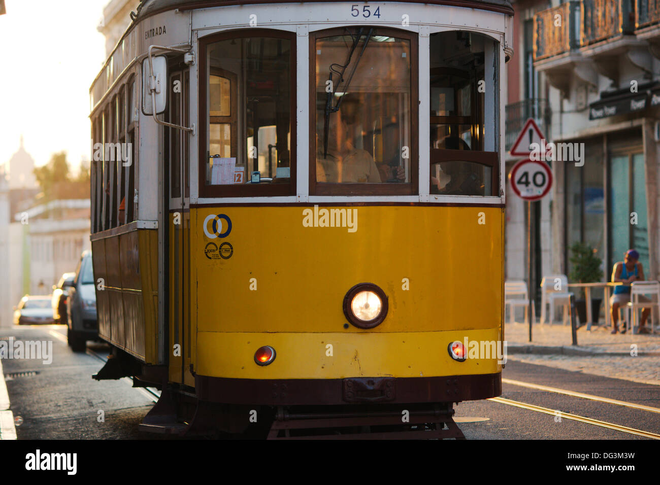 Lisbon's traditional yellow tram on the 28 line, passing at Calçada do ...