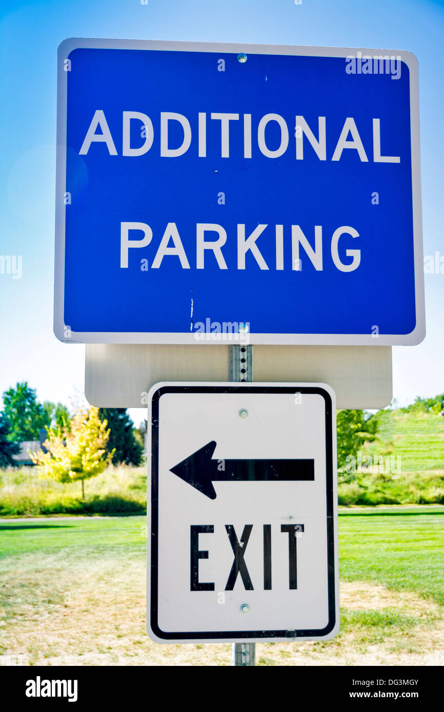 Exit and parking sign giving direction Stock Photo - Alamy