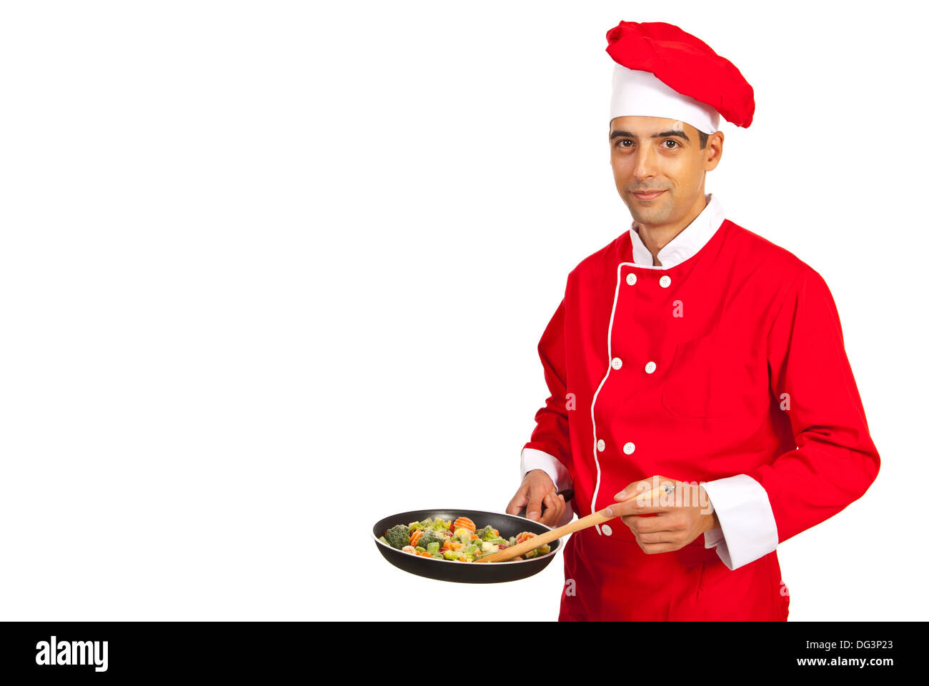 Chef man cooking vegetables in frying pan isolated on white background ...