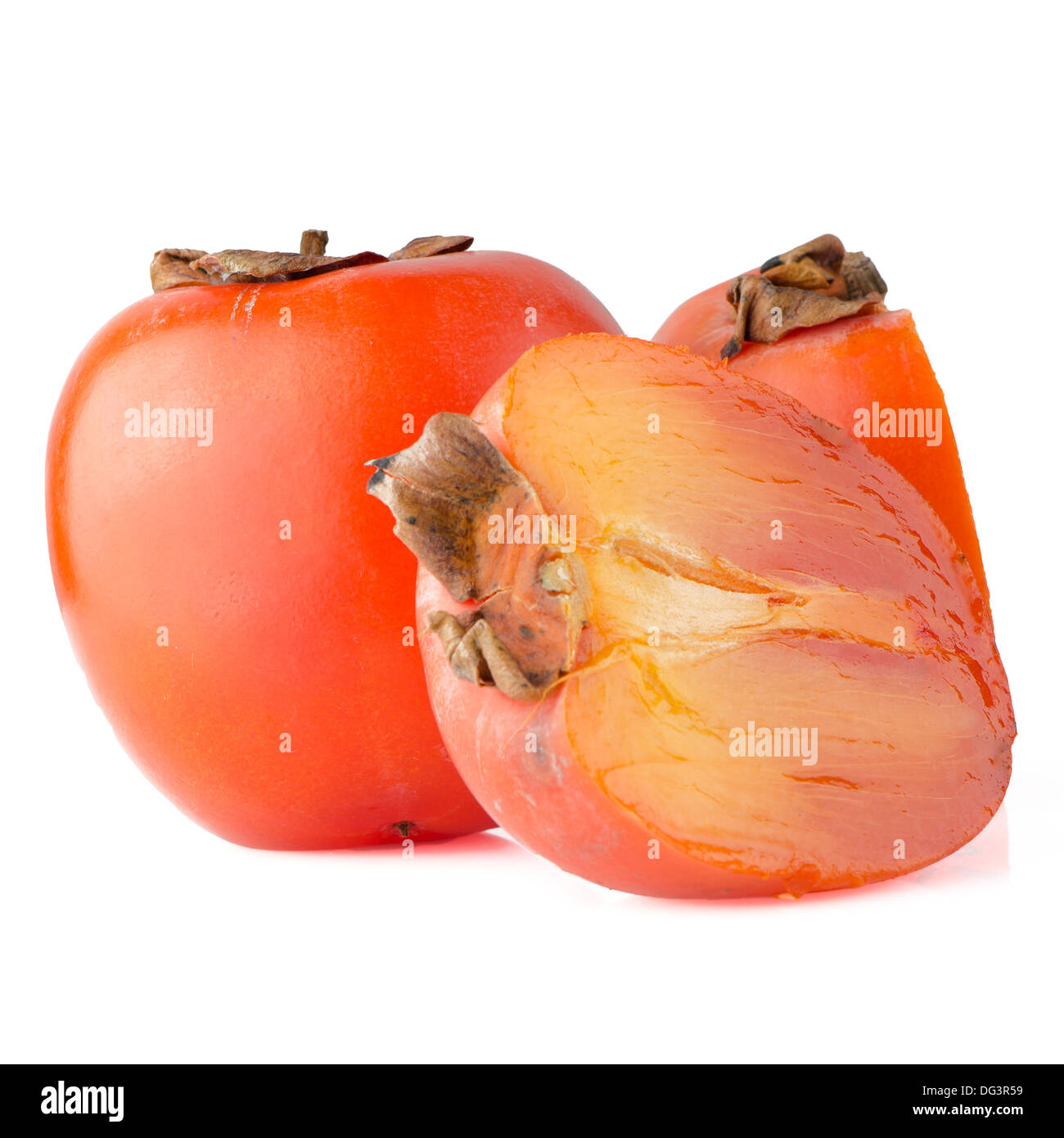 Ripe persimmons on white background Stock Photo - Alamy