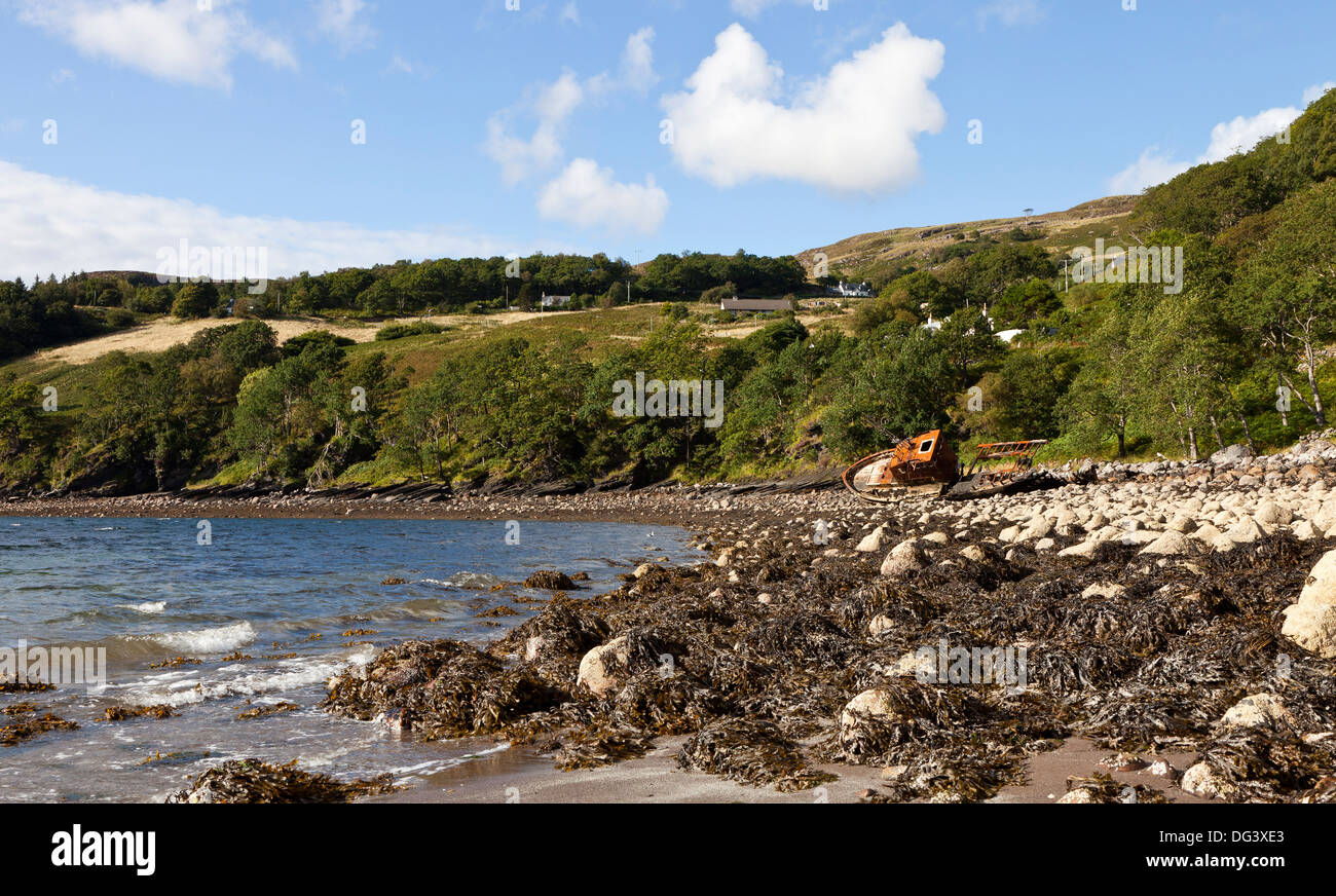 Lower Diabaig beach by Loch Diabaig with a wrecked boat on the shore ...