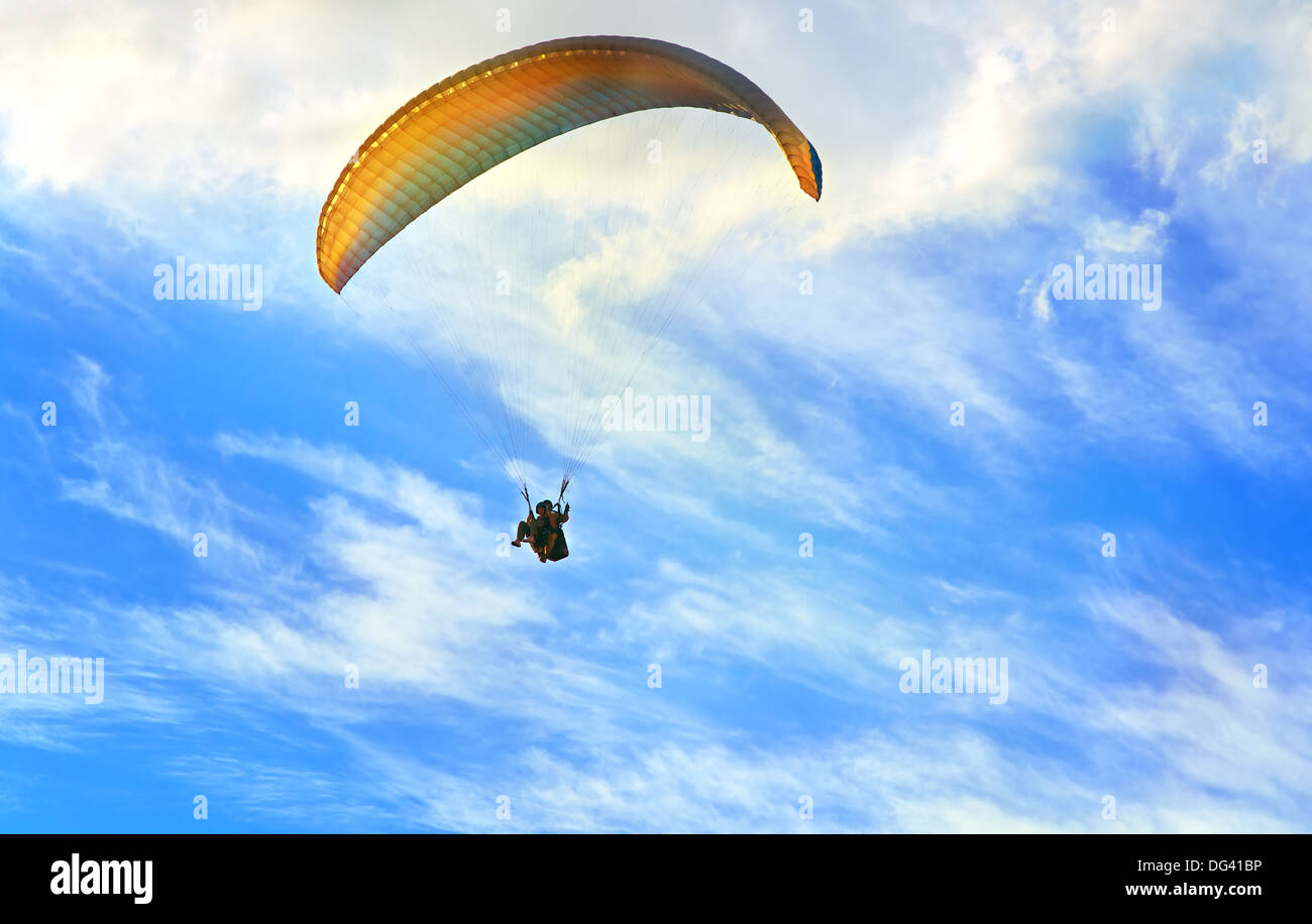 Paragliding extreme Sport with blue Sky and clouds on background ...