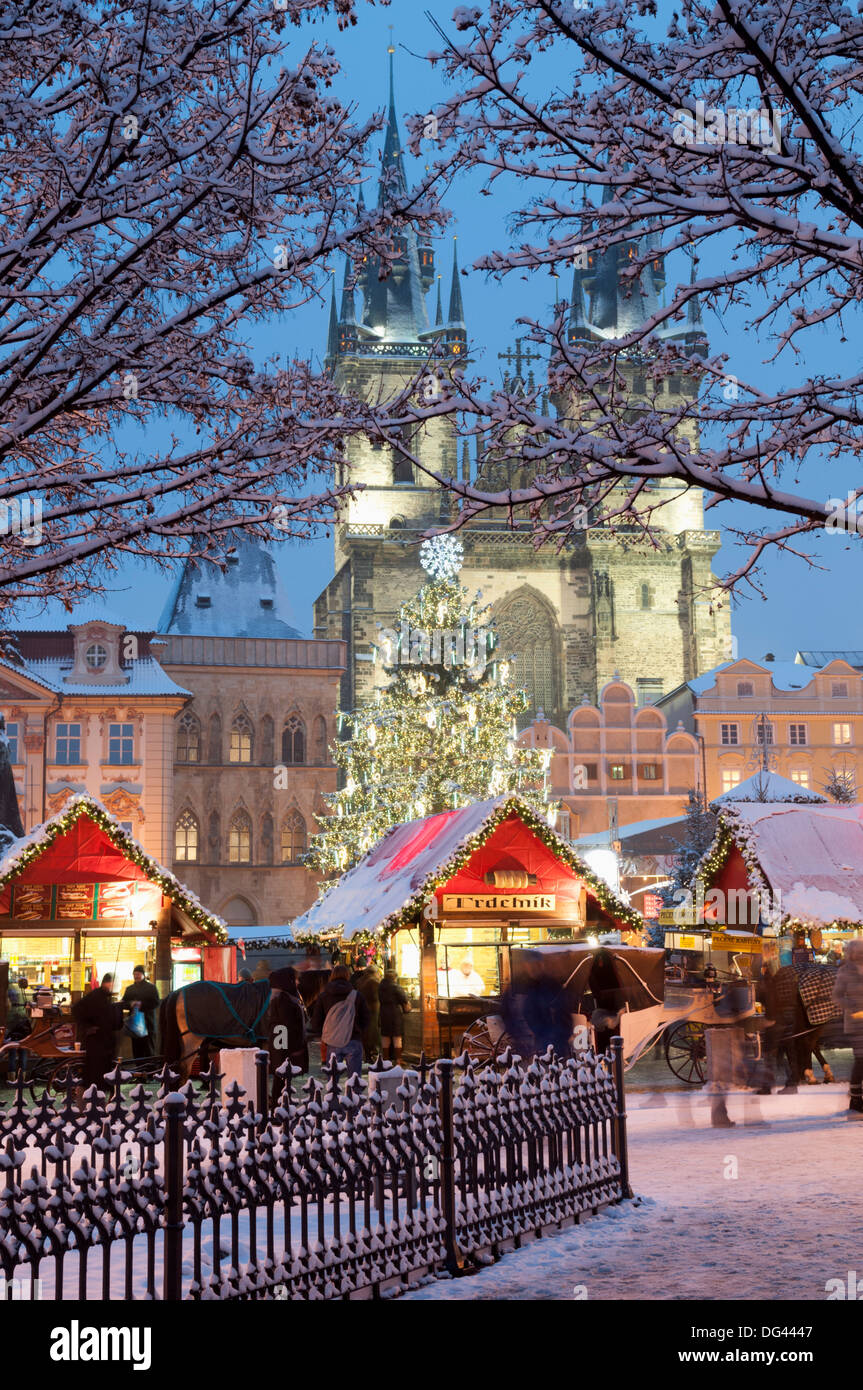 Snow-covered Christmas Market and Tyn Church, Old Town Square, Prague ...