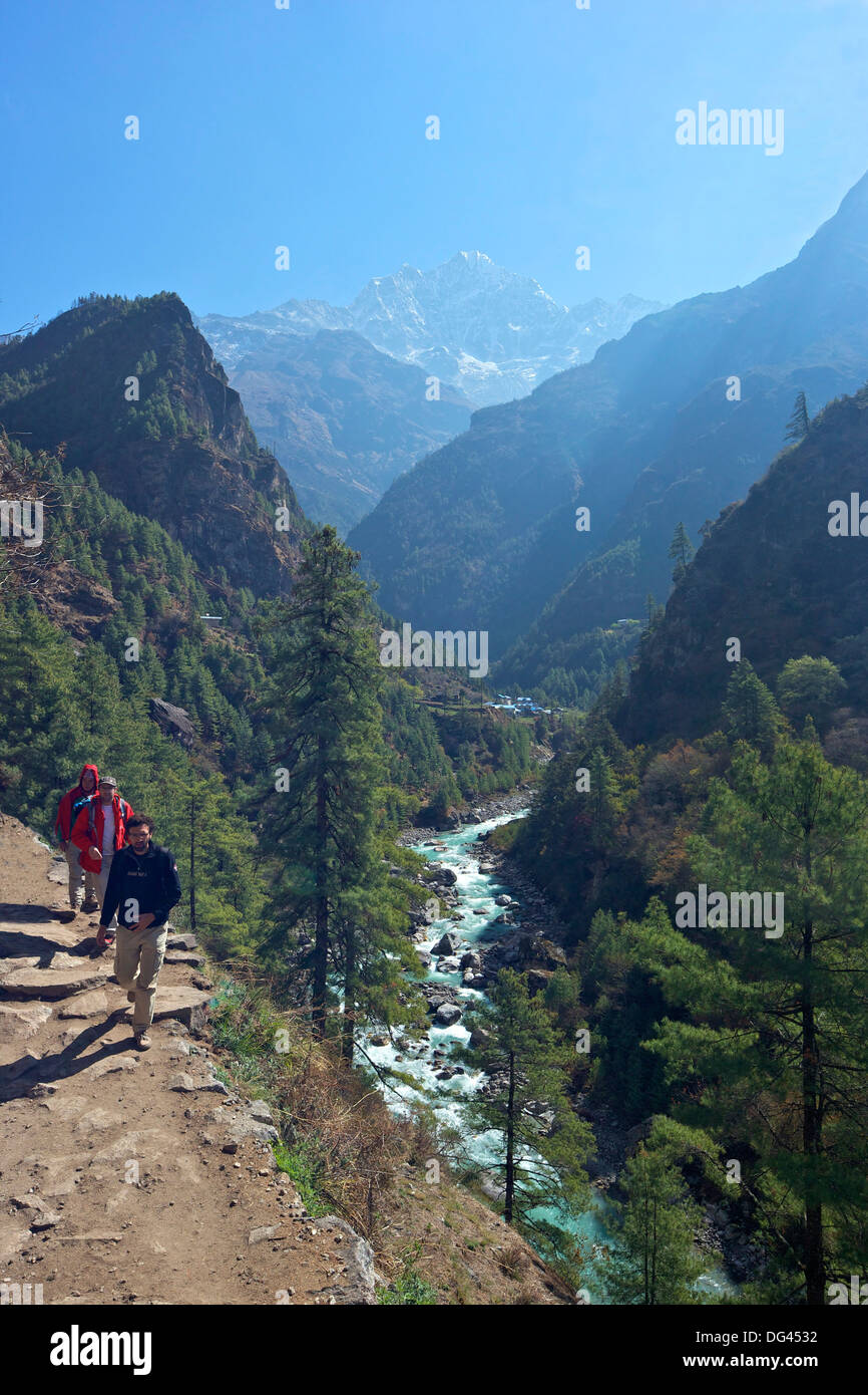 Trekkers on trail to Dudh Koshi river, between Phakding and Namche ...