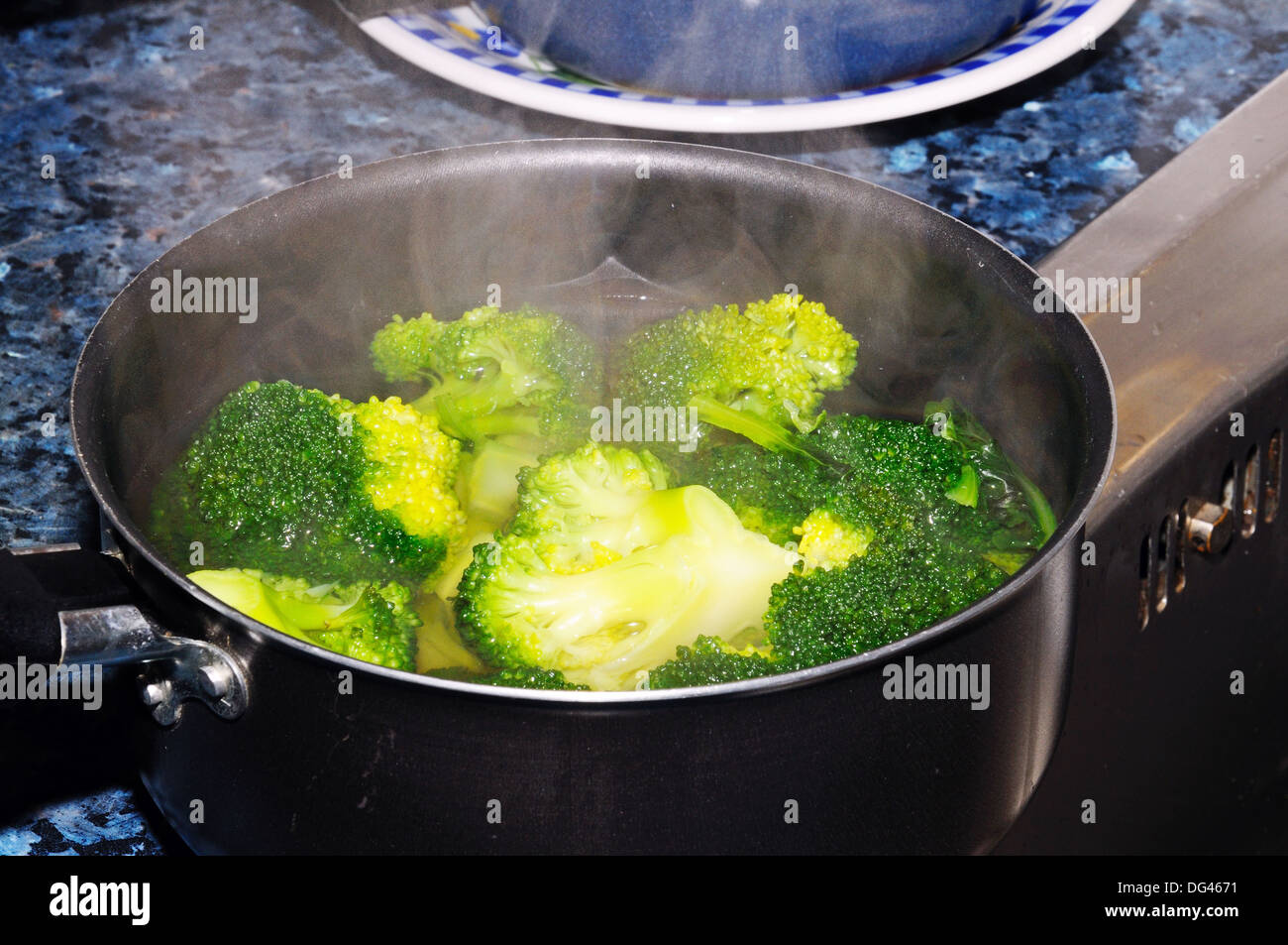 Cooked broccoli in a saucepan of water Stock Photo - Alamy