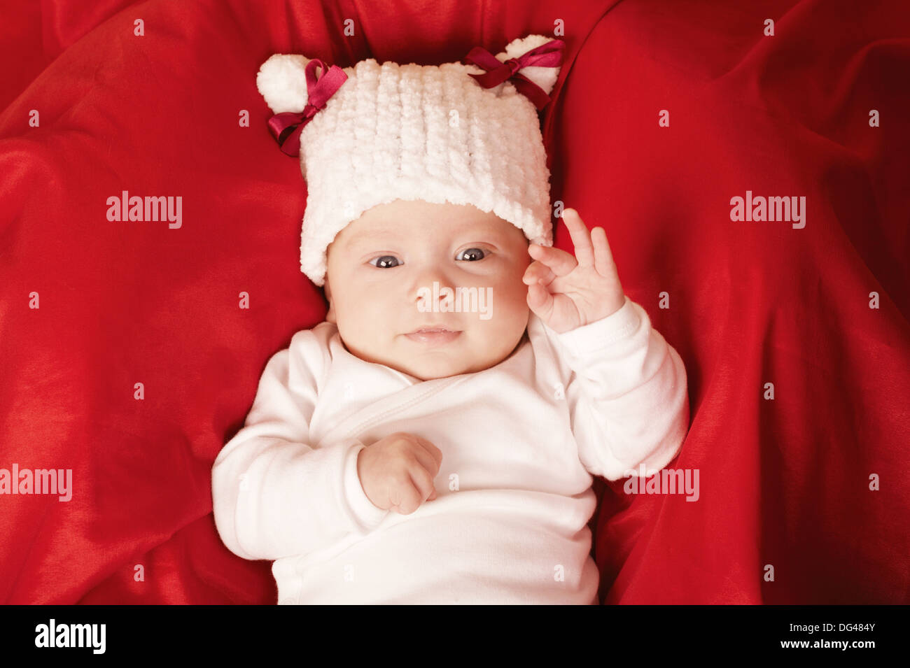 cute baby on red backround Stock Photo - Alamy