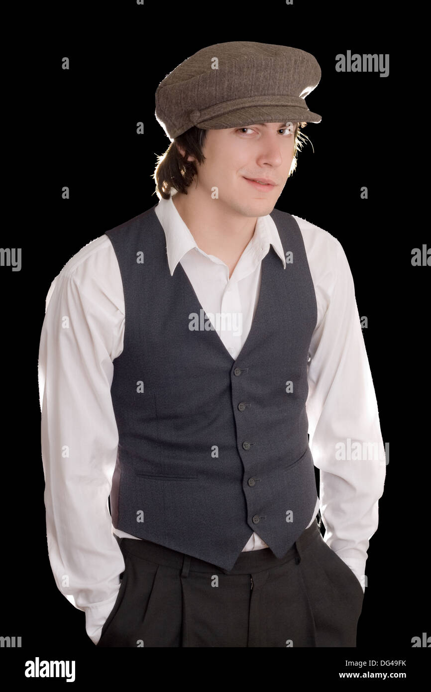 Young man standing with hands deep in his pockets Stock Photo - Alamy