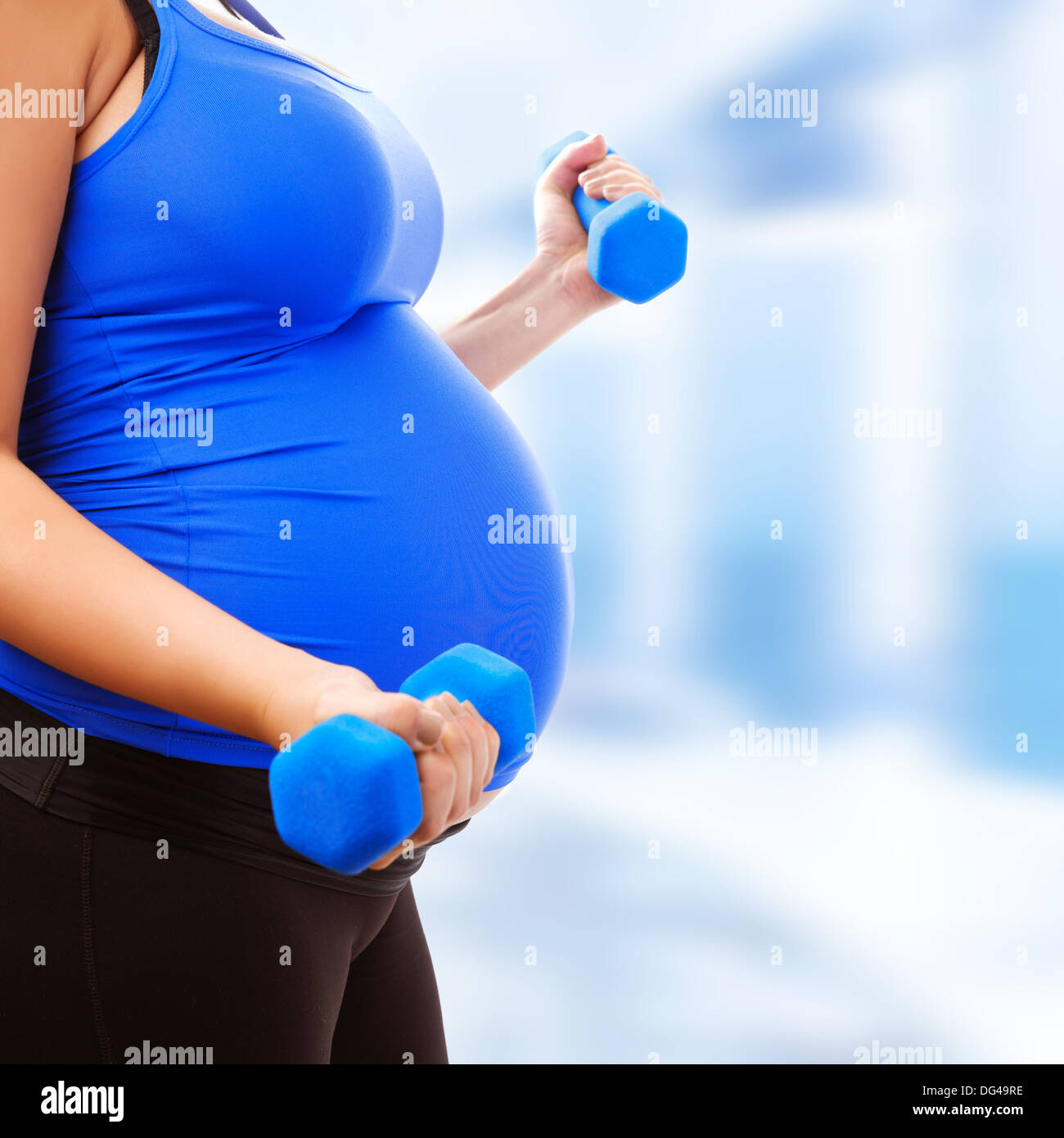 Pregnant Female Do Exercise In Sports Hall Side View Body Part