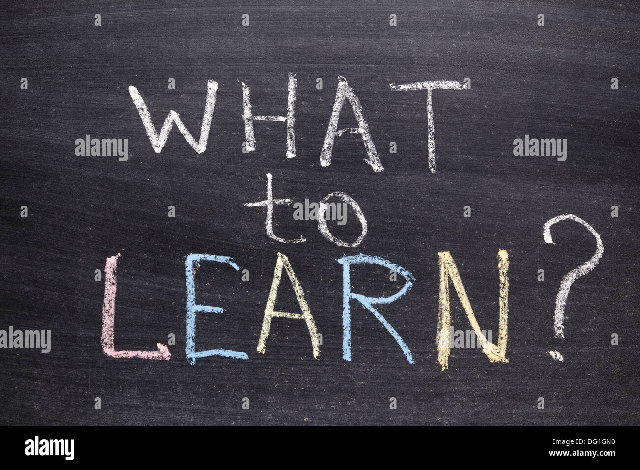 what to learn question handwritten on school blackboard Stock Photo - Alamy