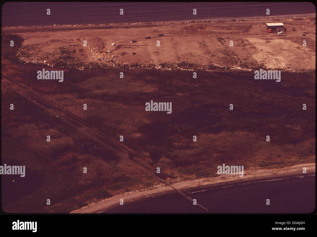 An aerial view of Middletown Dump located near a salt marsh and ...