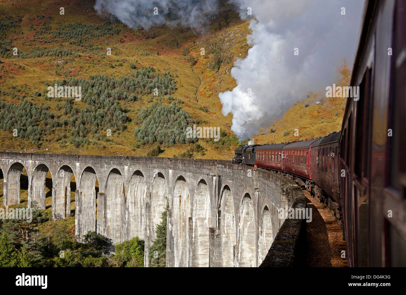 Jacobite Steam Train crossing Glenfinnan Viaduct, passengers view ...