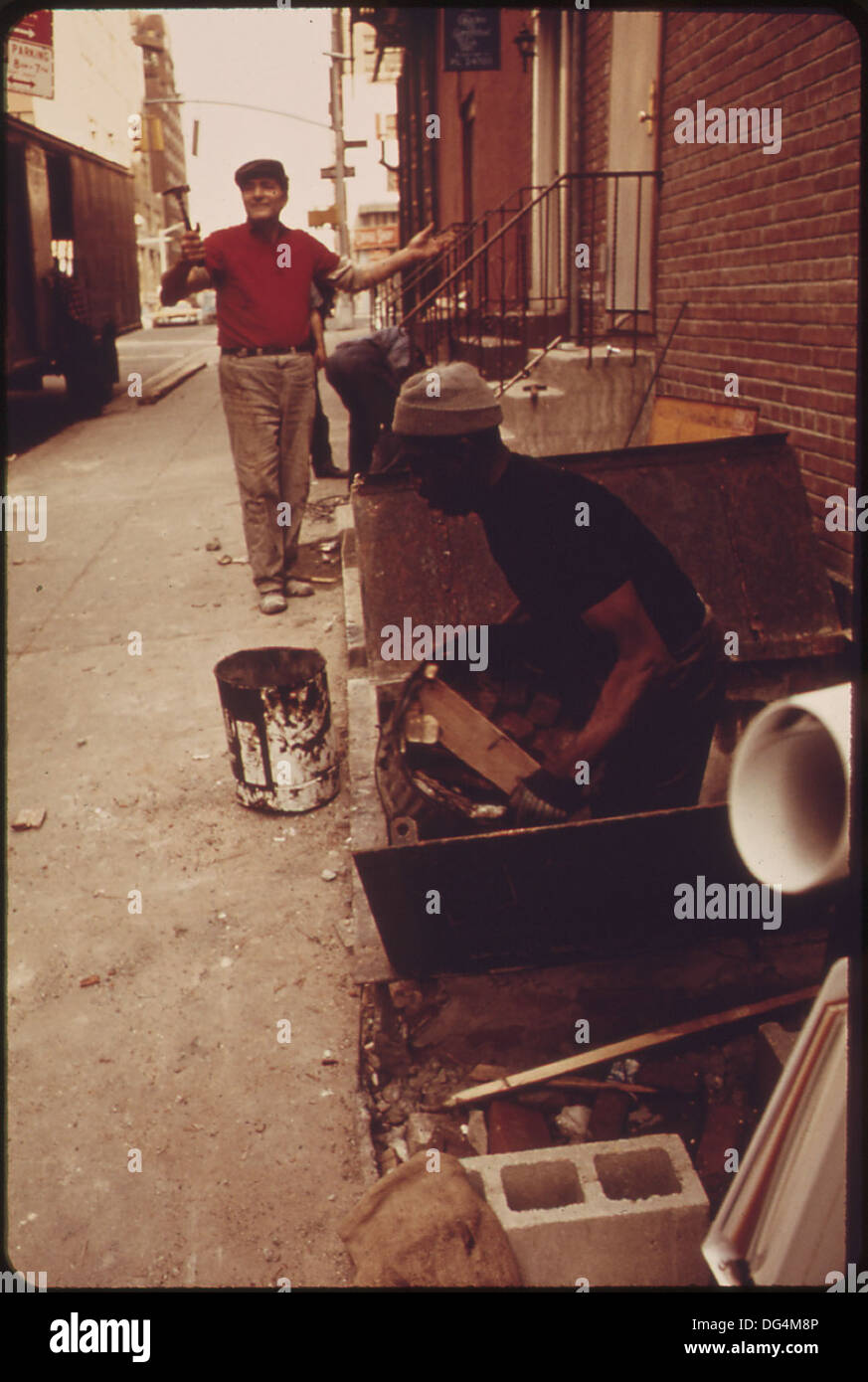 This image depicts an alley in Harlem, New York. Harlem, known for its ...