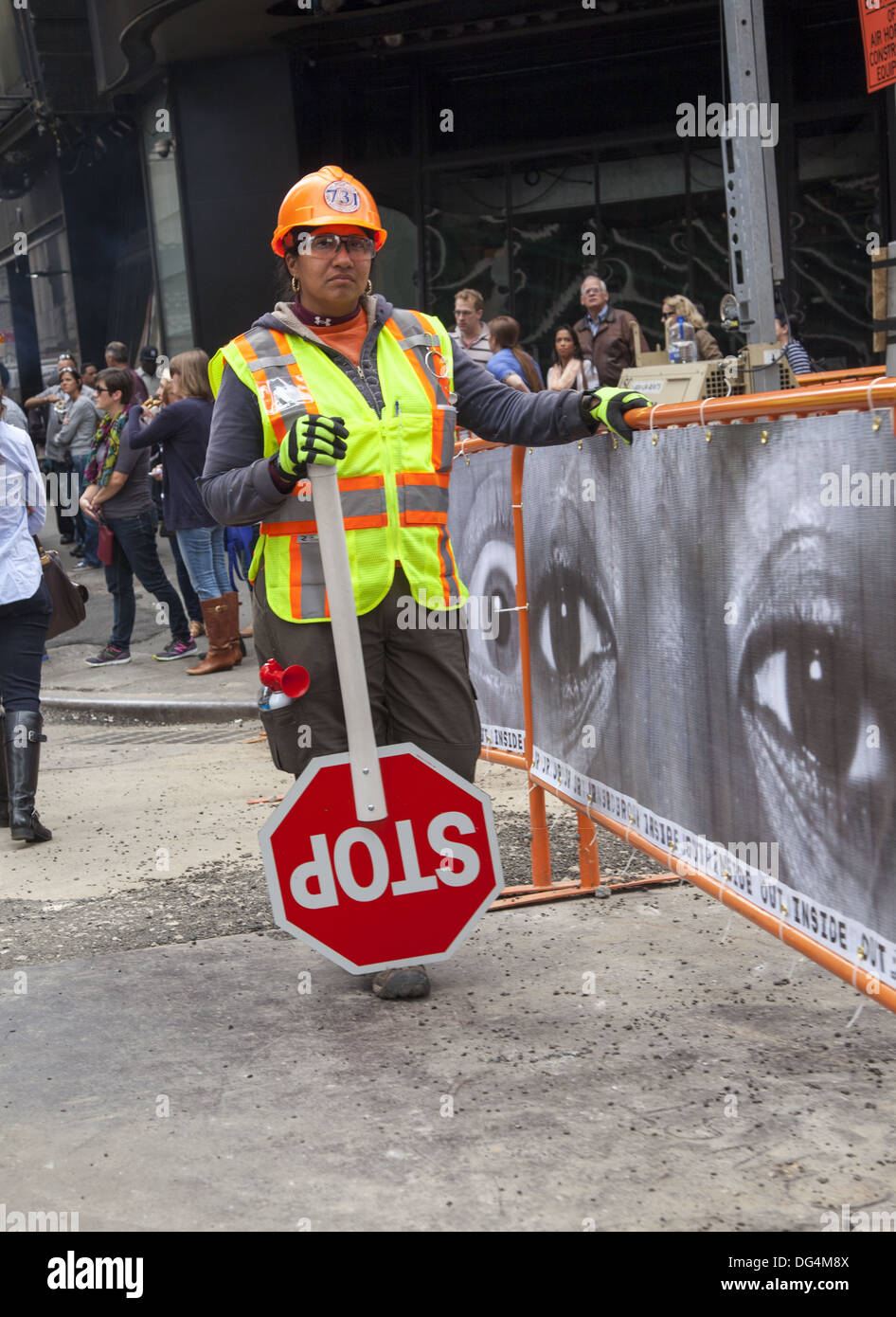 Female construction worker directs traffic in Times Square for ...