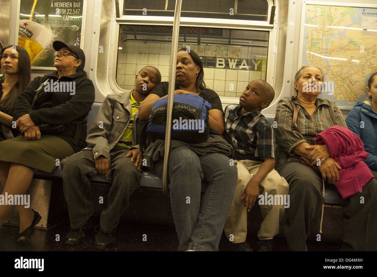 Mother and her boys ride the NYC subway train in Manhattan during rush ...