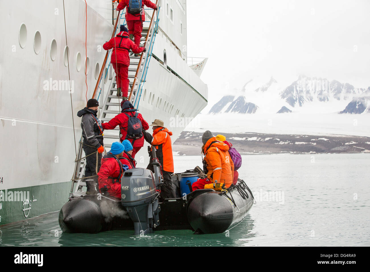 Passengers disembark Zodiaks onto the Russian research vessel, AkademiK ...