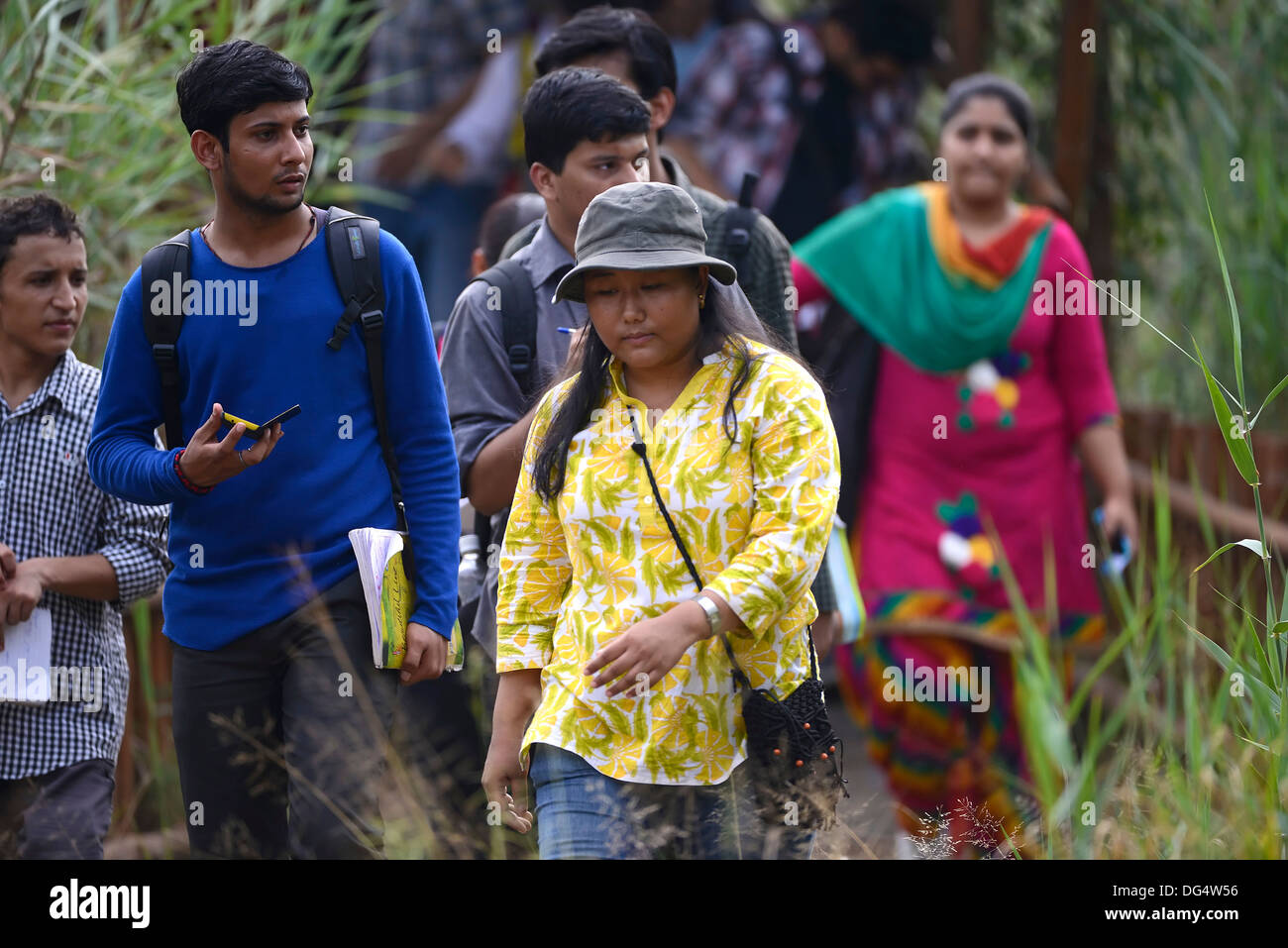 Teacher With Children Preparing Notes During Field Trip Stock Photo - Alamy