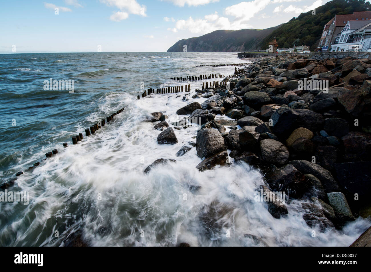 High tide with dramatic clouds over the coastal village of Lynmouth on ...