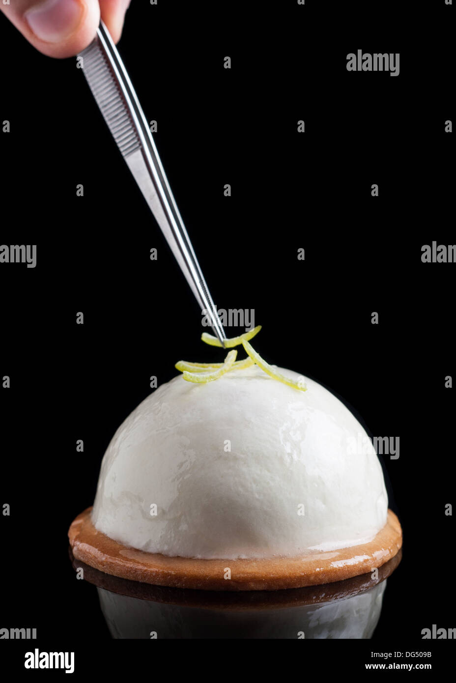 Individual lemon mousse isolated on black Stock Photo - Alamy