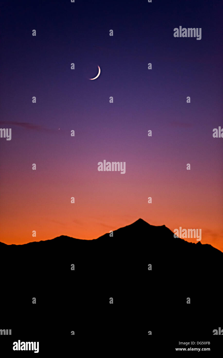 Moon and mountain in the night Stock Photo - Alamy