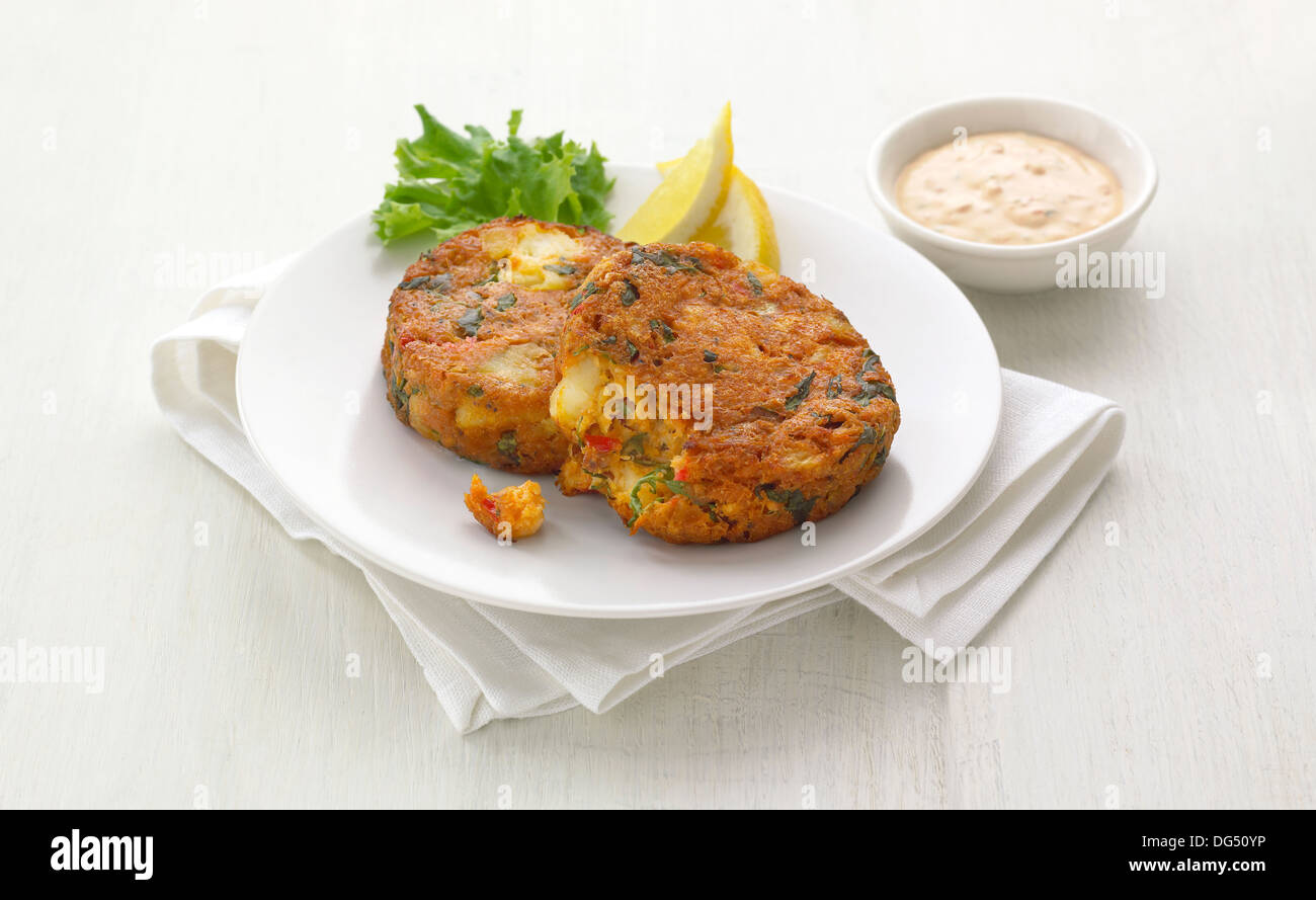 Fish Cakes on a white plate with garnish Stock Photo - Alamy