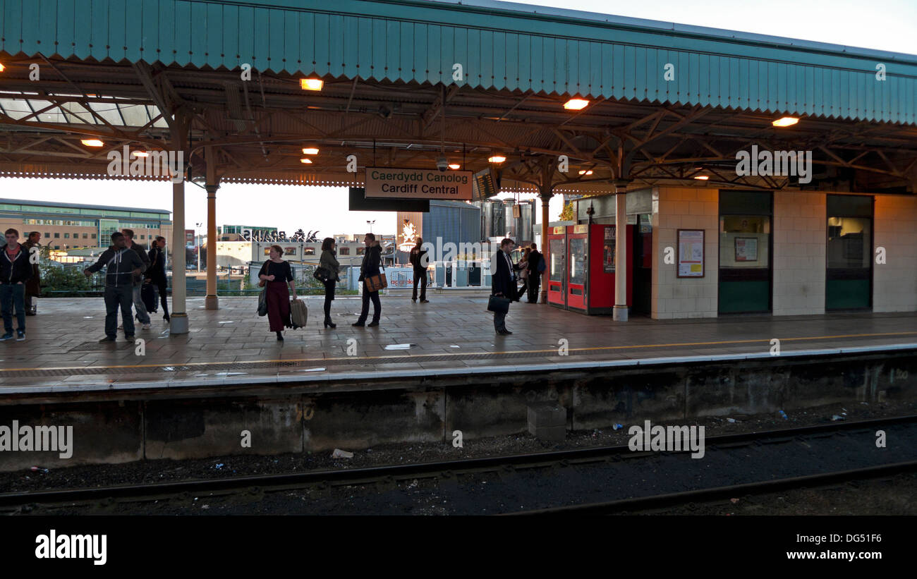 Commuters standing on the platform at Cardiff Central Railway Station ...